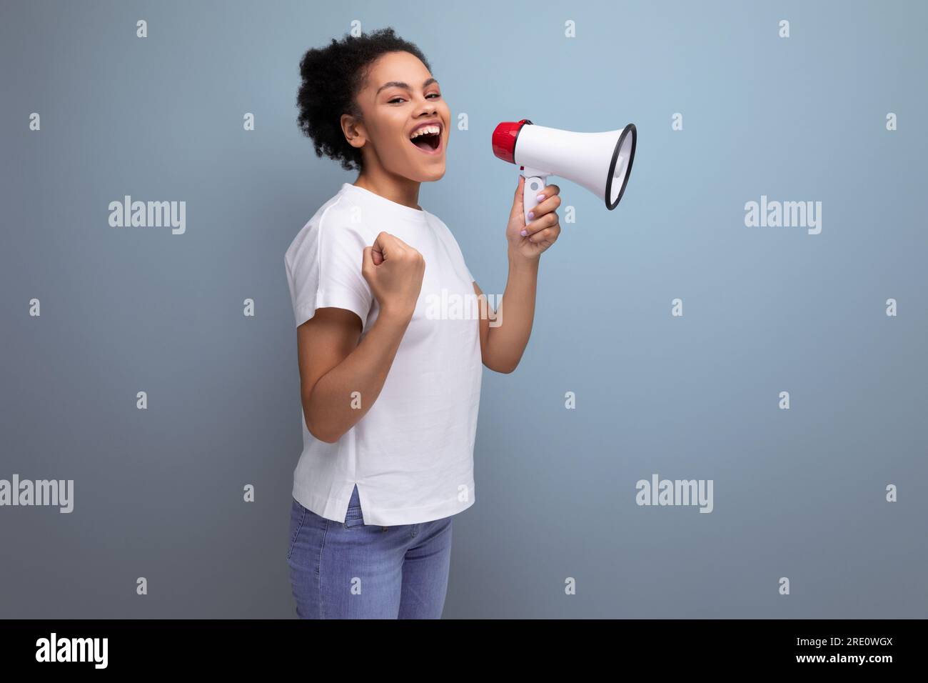 Woman speaking through megaphone in hi-res stock photography and images ...