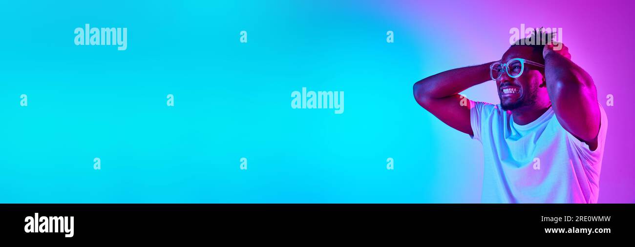 Banner with african man in glasses looking away, scared, shocked and ...