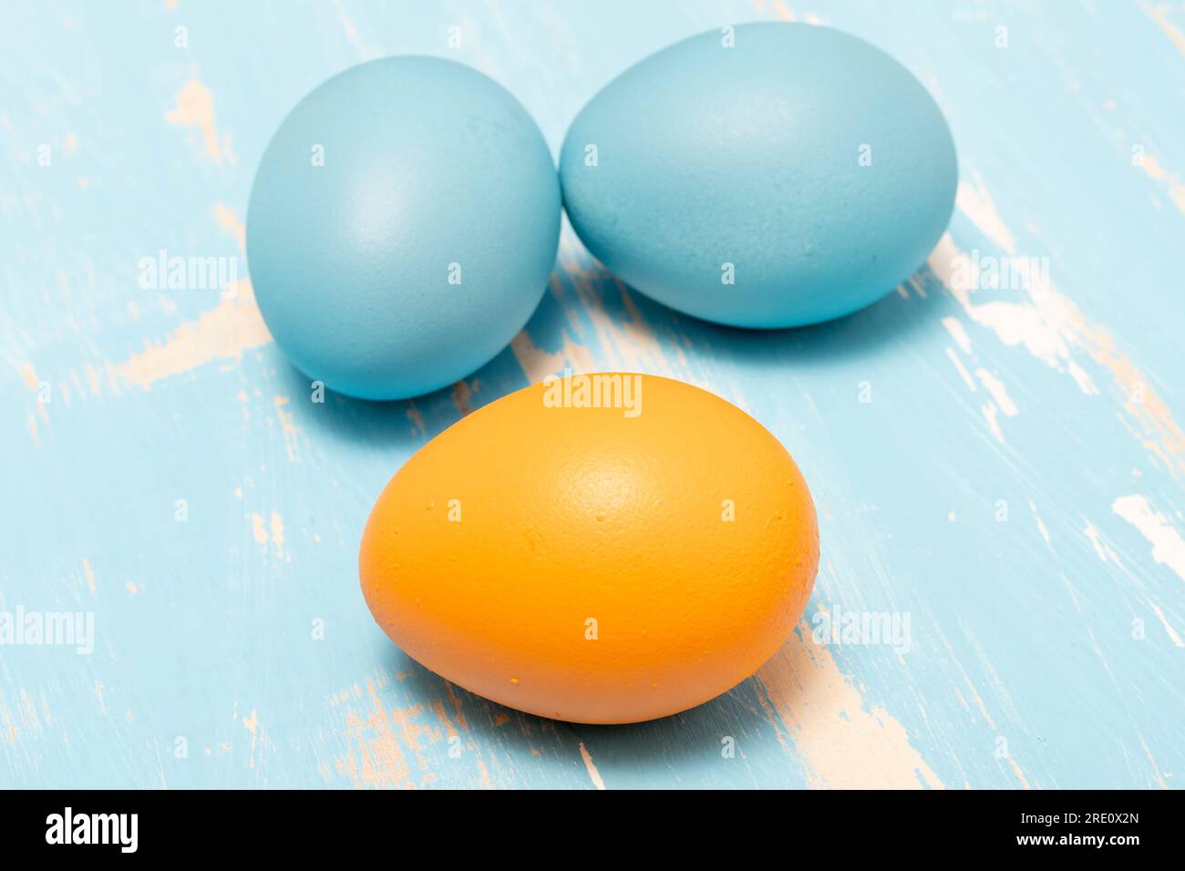 Eggs symbolizing the Easter holiday in blue and orange color on a ...