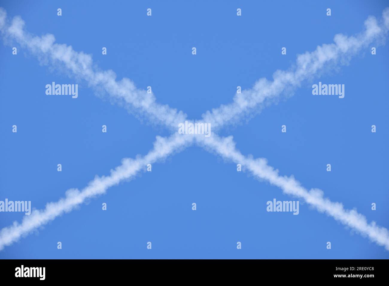 Close up two crossed contrails, white airplane traces, jet aircraft ...
