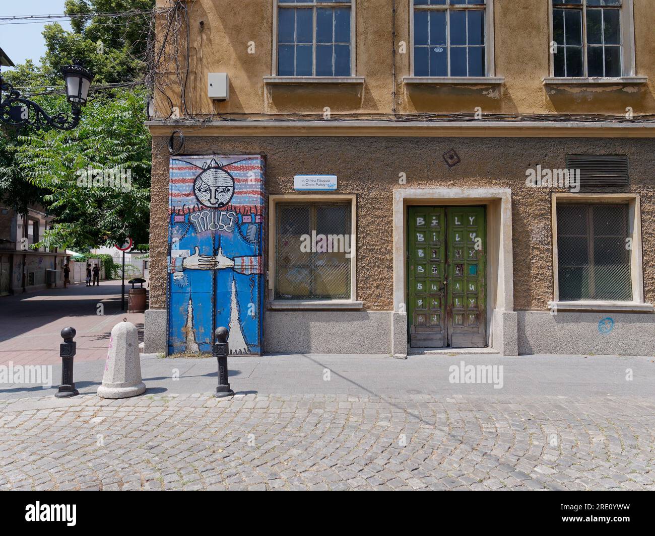 Borwn historic building in Plovdiv, Bulgaria with Billy written on the ...