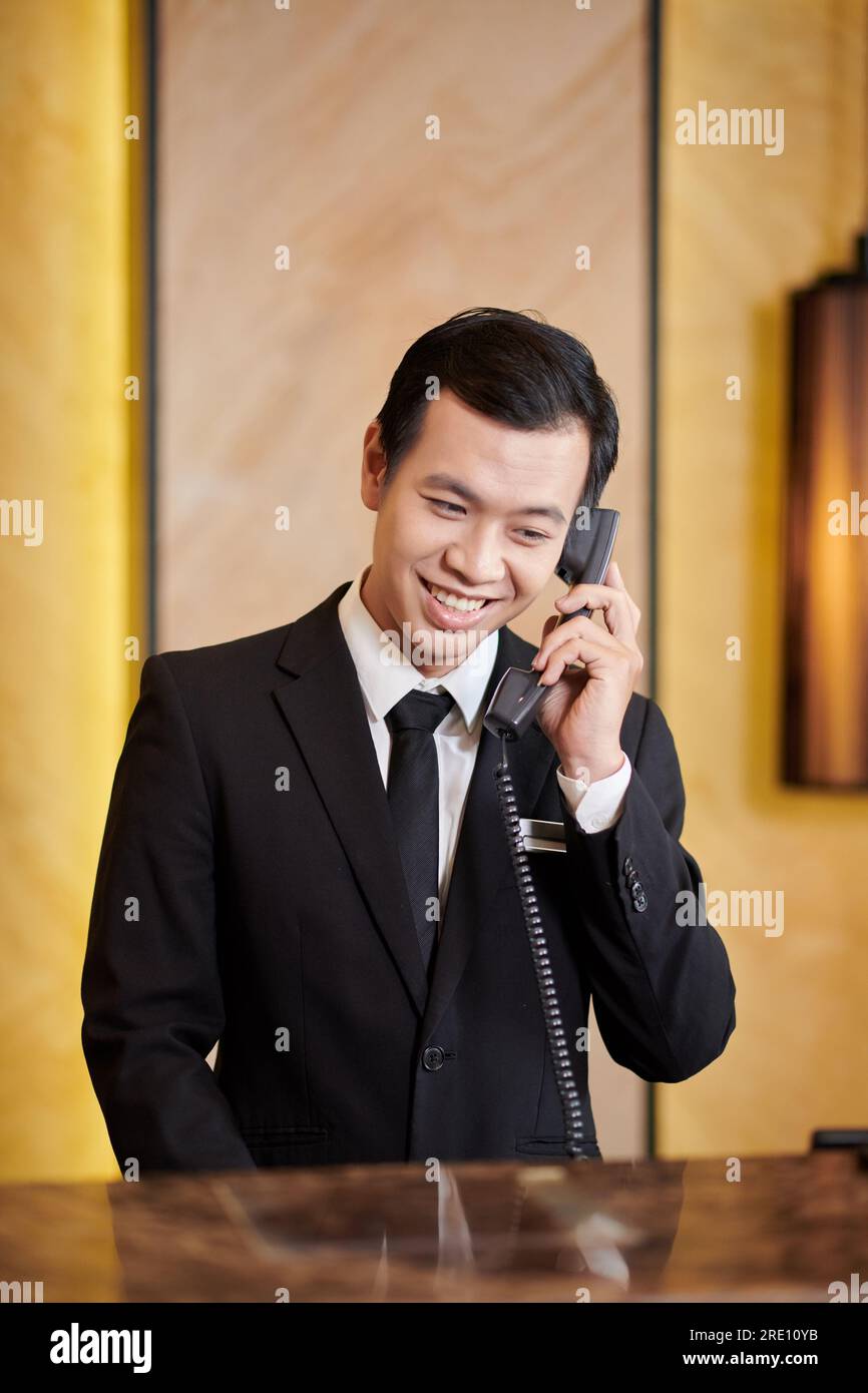 Answering booking hi-res stock photography and images - Alamy