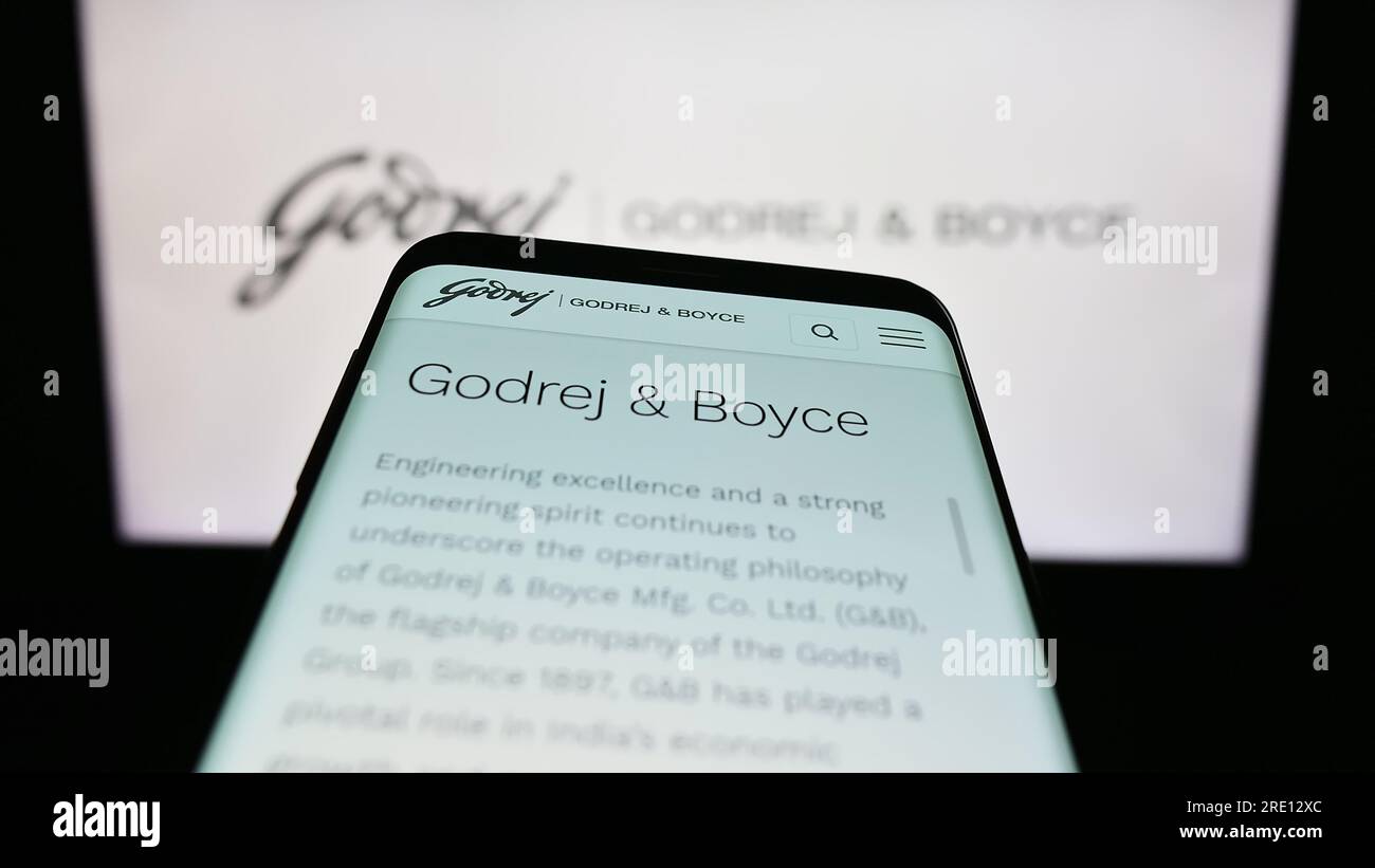 Mobile phone with webpage of Indian company Godrej and Boyce Mfg. Co ...