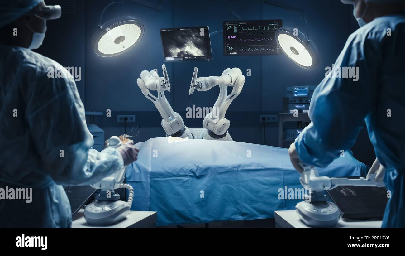Two Surgeons Observing High-Precision Programmable Automated Robot Arms ...