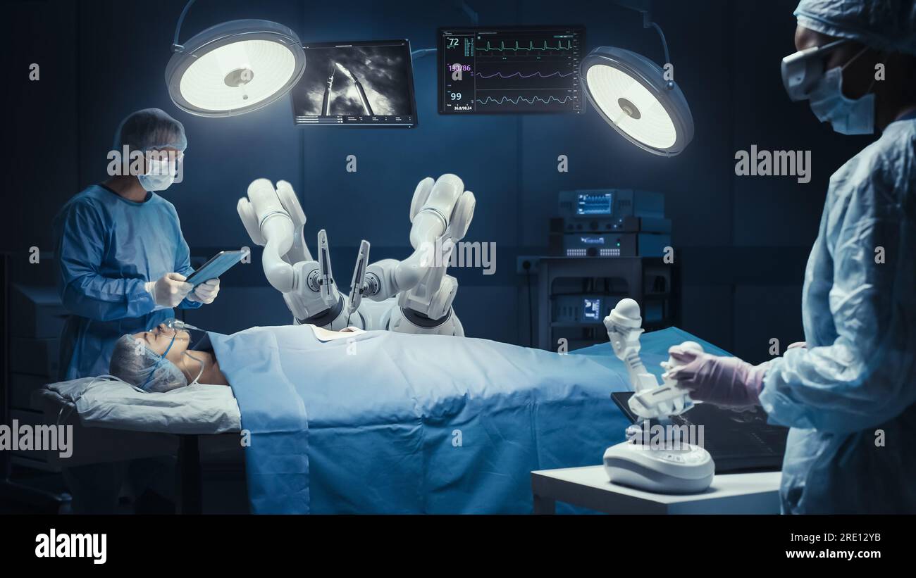 Two Surgeons Observing High-Precision Programmable Automated Robot Arms ...