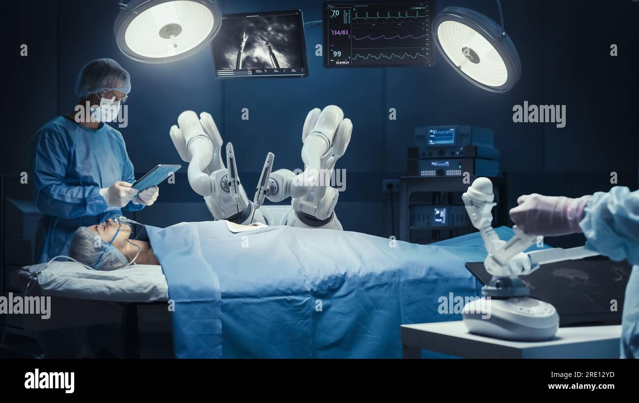 Two Surgeons Observing High-Precision Programmable Automated Robot Arms ...