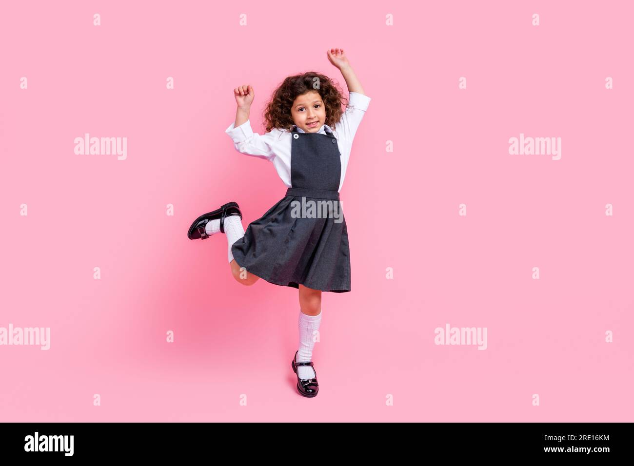 Full body portrait of cheerful diligent schoolkid stand one leg dancing ...