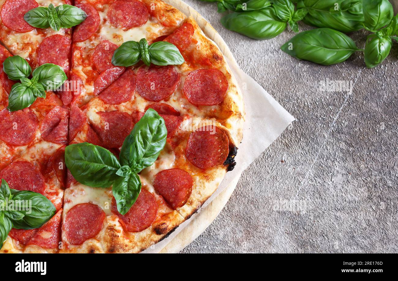 homemade pizza with pepperoni and basil Stock Photo - Alamy