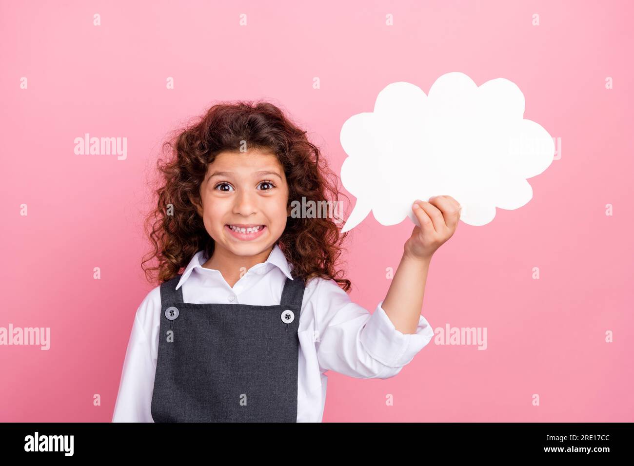 Portrait of positive friendly schoolkid beaming smile hand hold empty ...