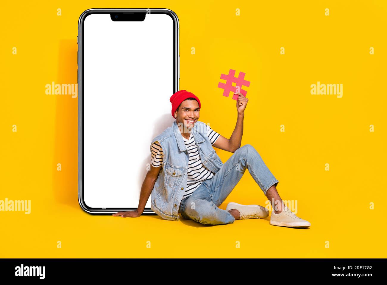 Full length photo of sweet cute man wear jeans outfit holding hash tag ...