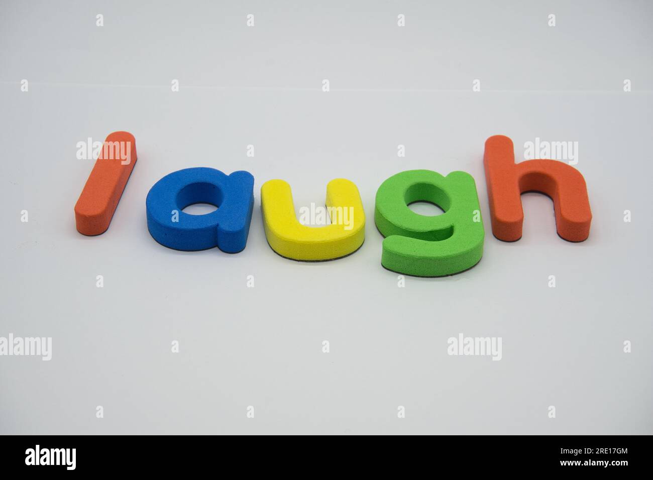 Laugh in colourful lower case letters on a white background Stock Photo ...