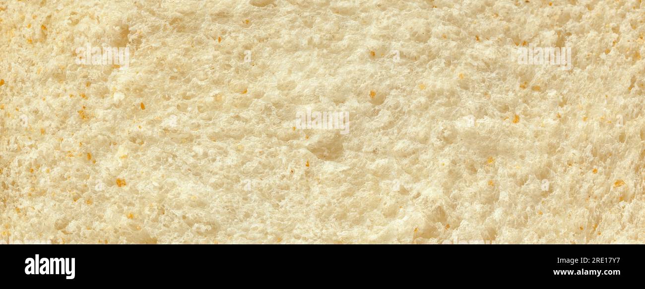 Structure of slice of freshly baked white bread, bakery background ...