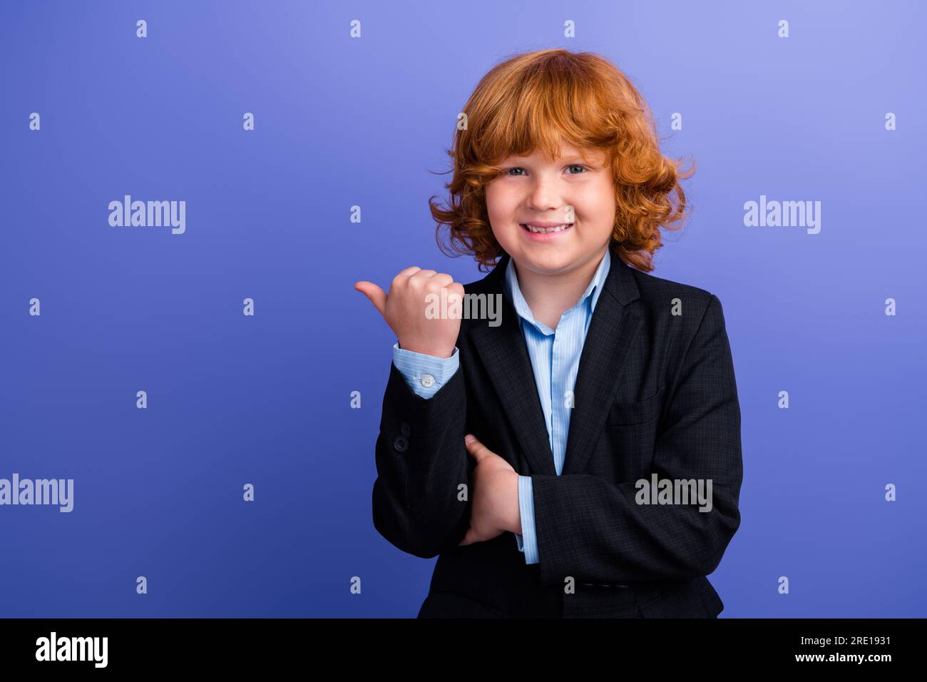 Photo of small friendly positive boy toothy smile indicate thumb finger ...
