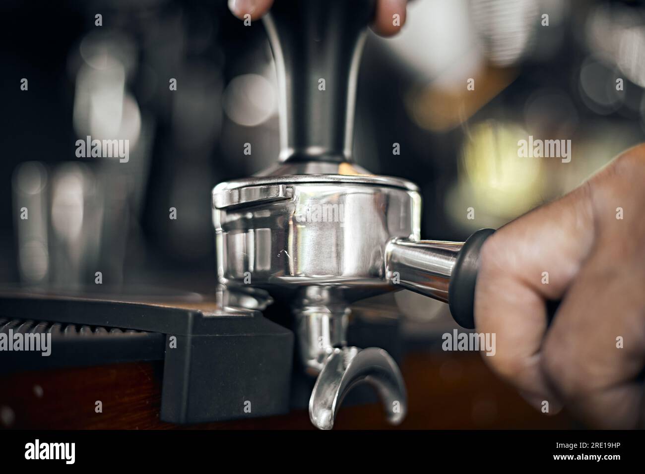 Hand tamping fresh ground coffee hi-res stock photography and images ...