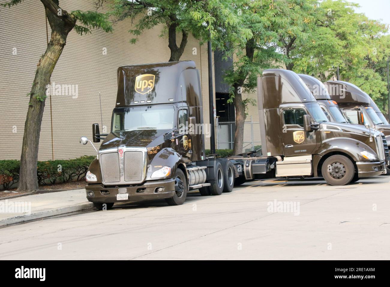 UPS trucks sit in the company parking lot at the UPS Customer Care ...