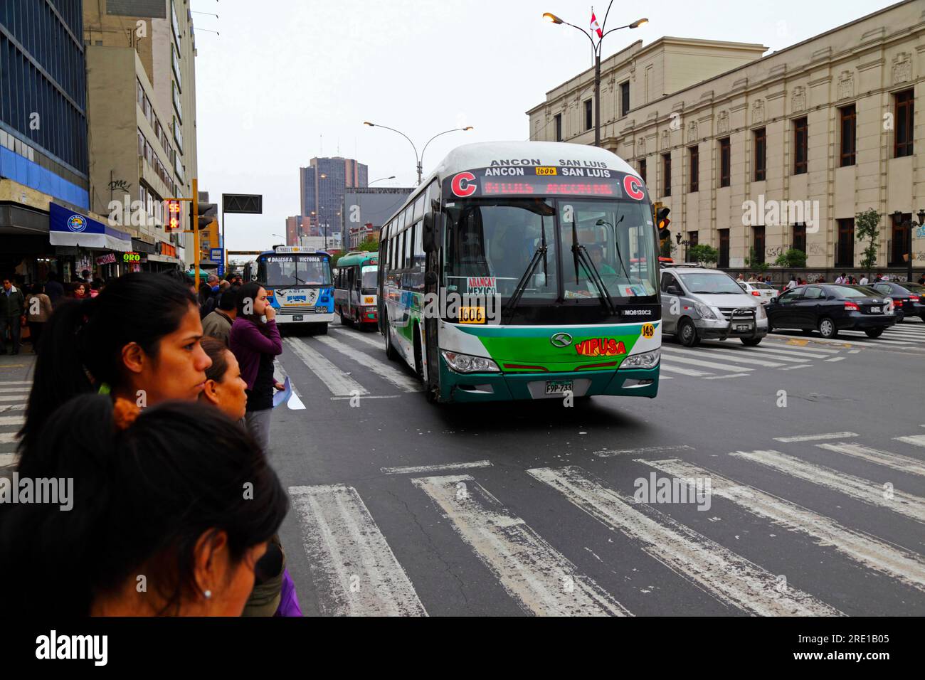 C Line public transport minibus, busy traffic and zebra crossing on Av ...