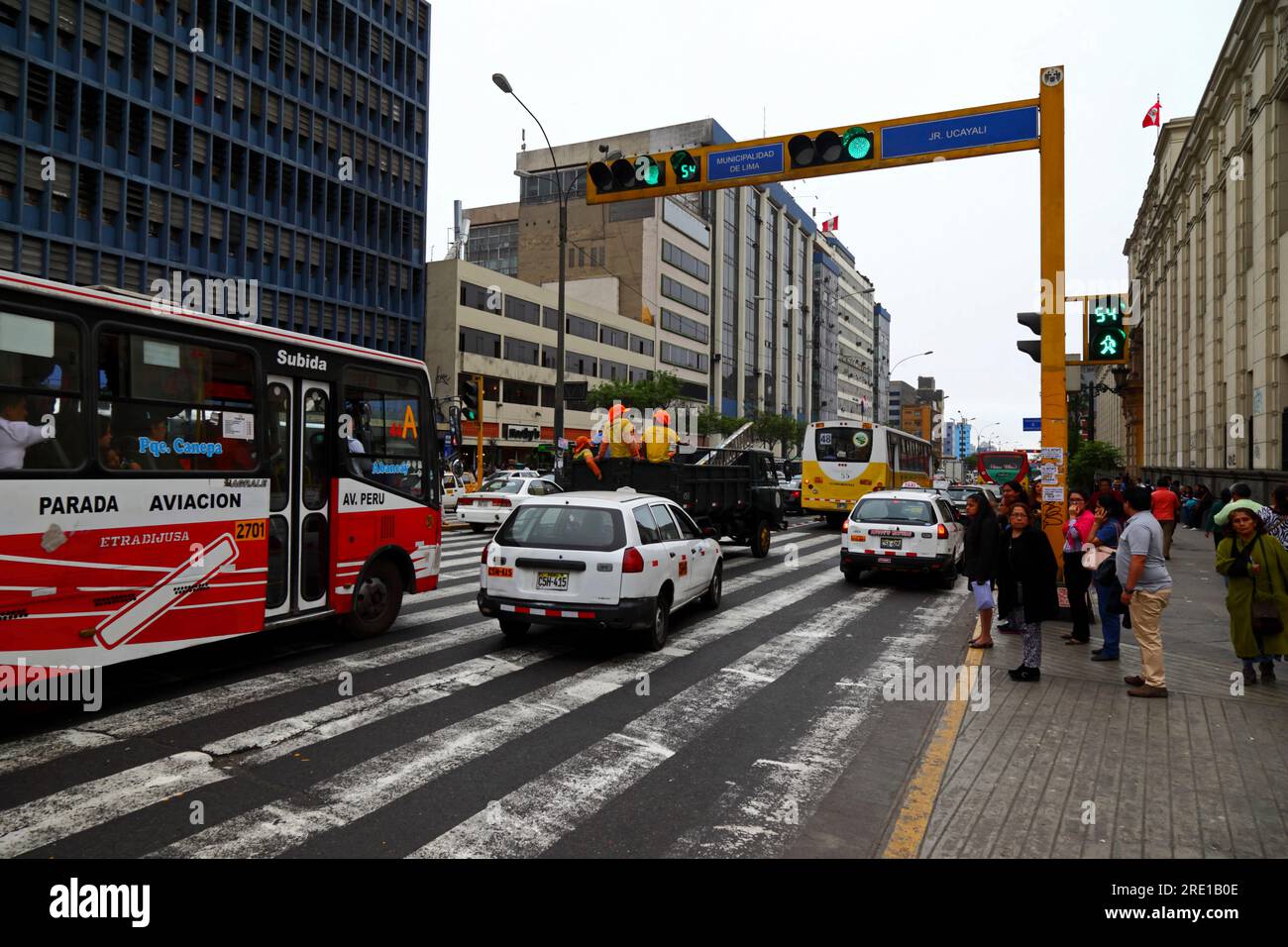 Public transport minibus, busy traffic and zebra crossing on Av Abancay ...