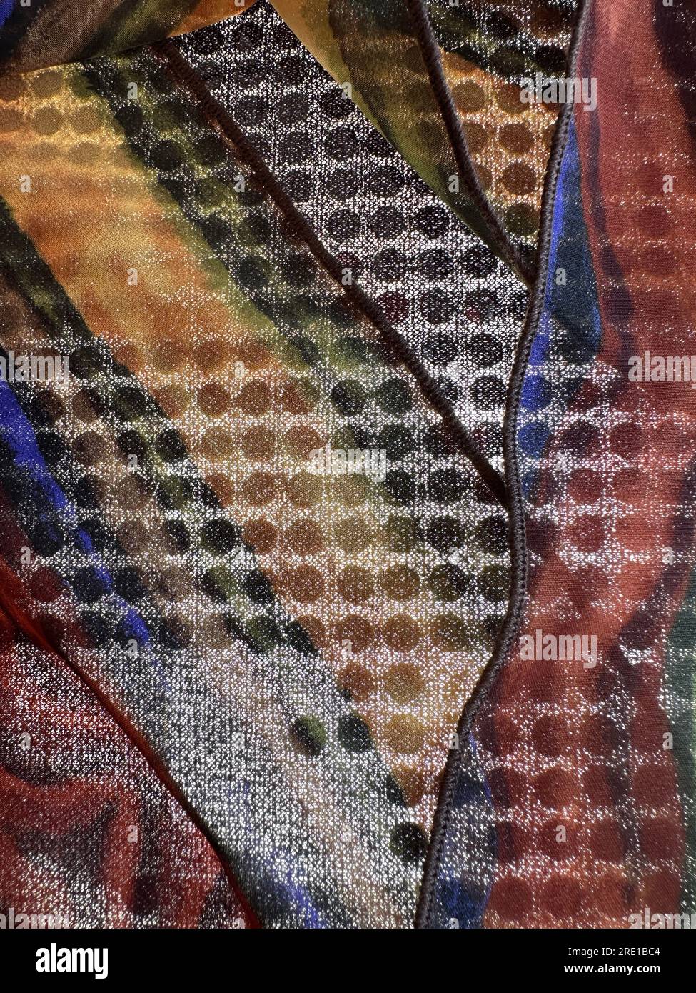 Diagonal lines and dots in rows highlight this backlit fabric picture ...