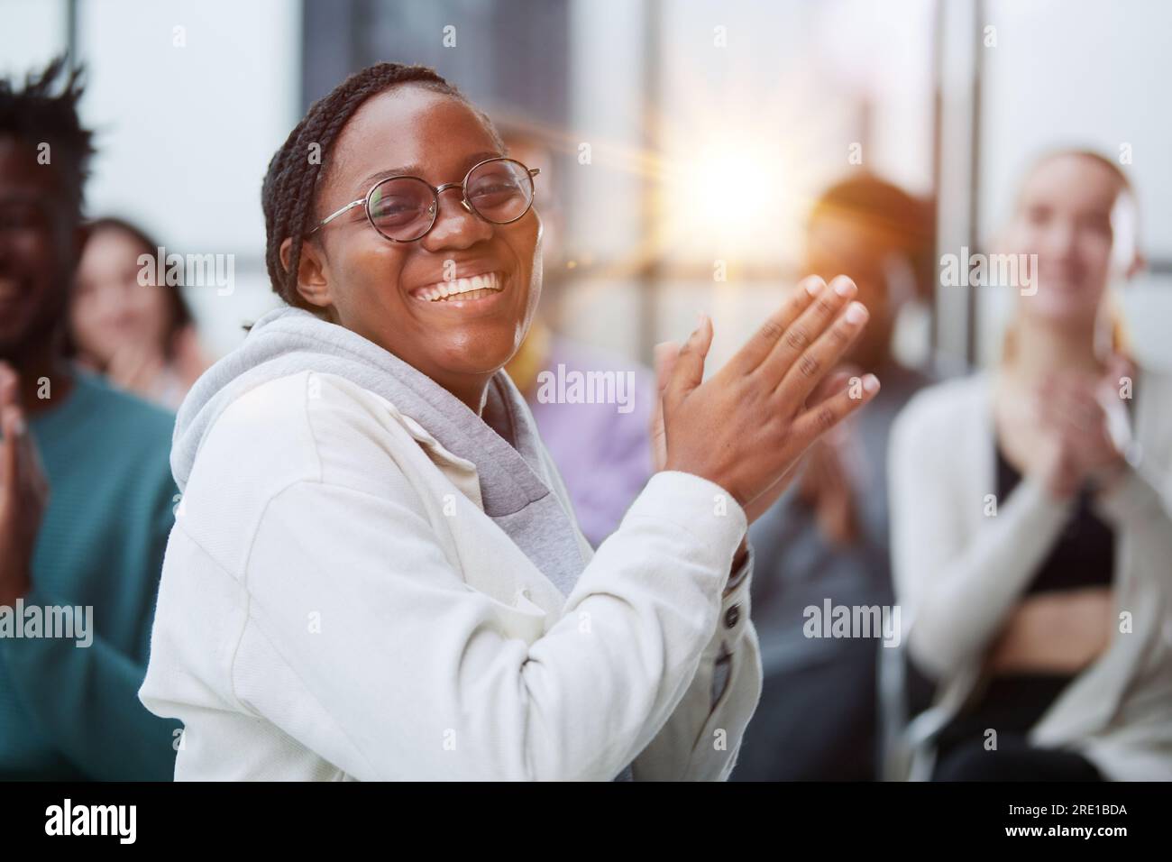 Clapping hispanic woman wearing hi-res stock photography and images - Alamy