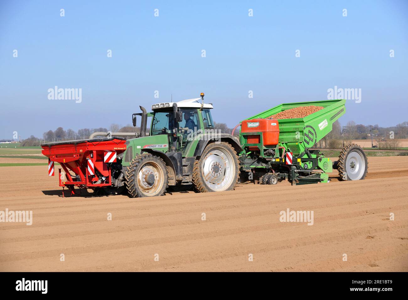 Potato planting, mechanized sowing with a tractor Stock Photo - Alamy