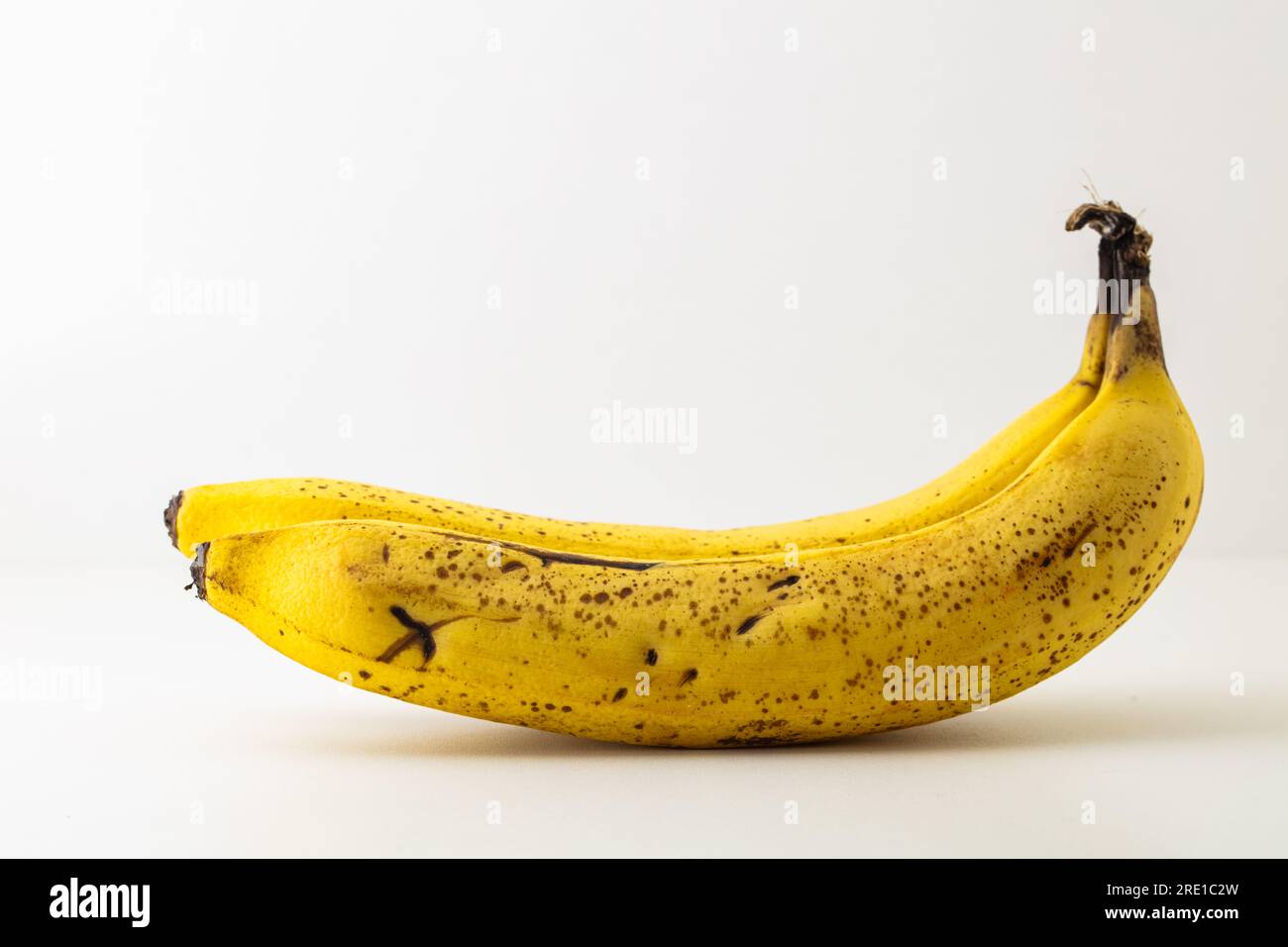 Two ripe bananas isolated on white background Stock Photo - Alamy