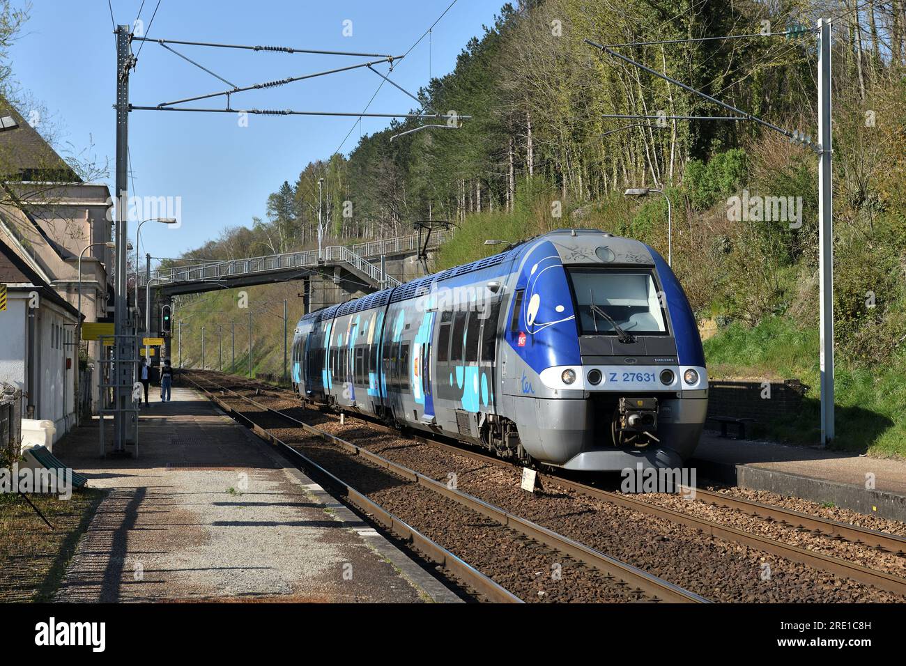 Intercity local train along the platform at the railway station of ...