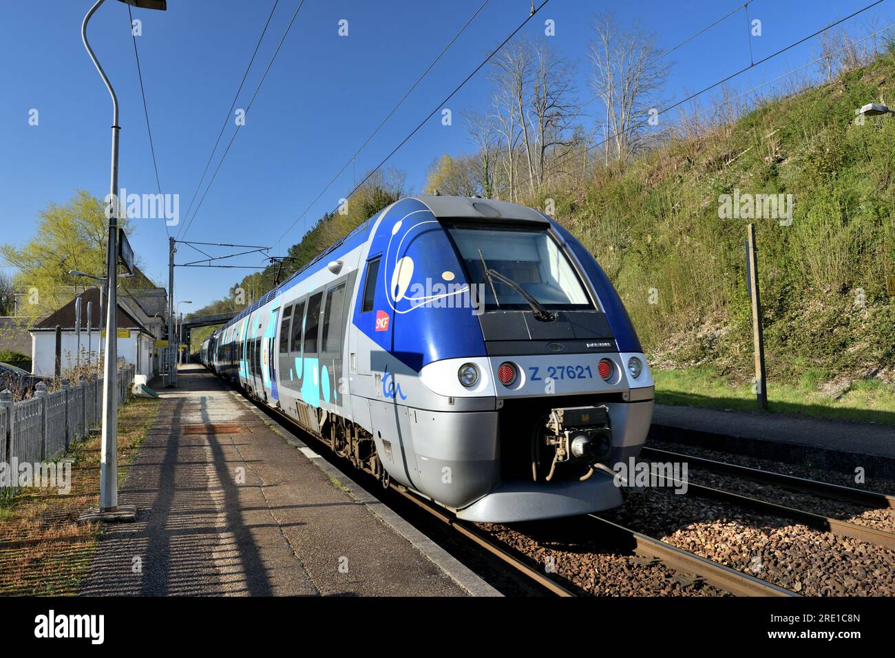 Intercity local train along the platform at the railway station of ...