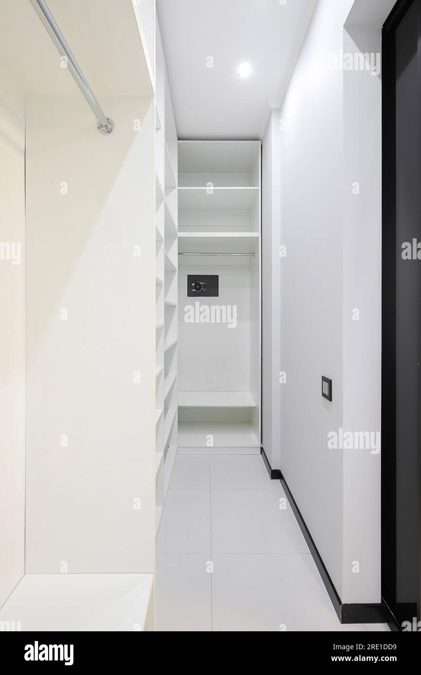 White wardrobe with shelves and safe in the dressing room Stock Photo ...