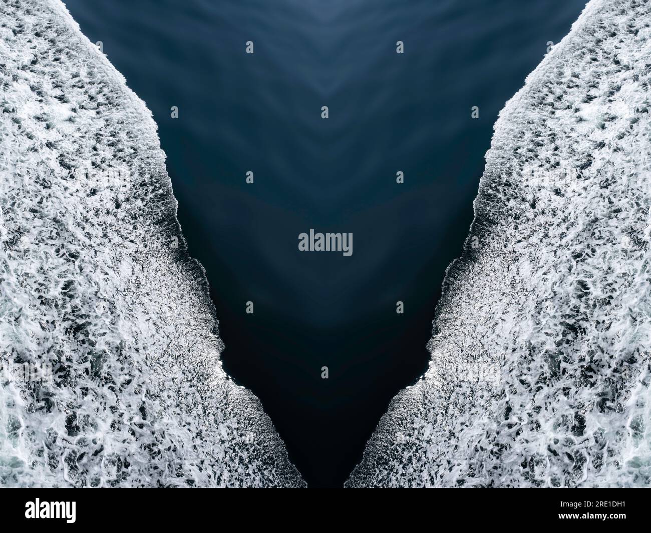 Bow waves of a ship with foam on the water of the sea. Aside splashing ...