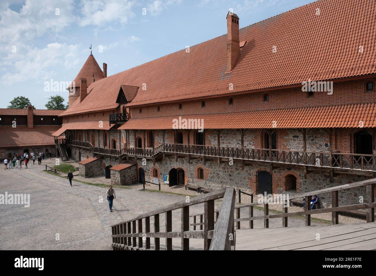 Old Trakai Castle with its wooden stair galleries and corner tower in ...