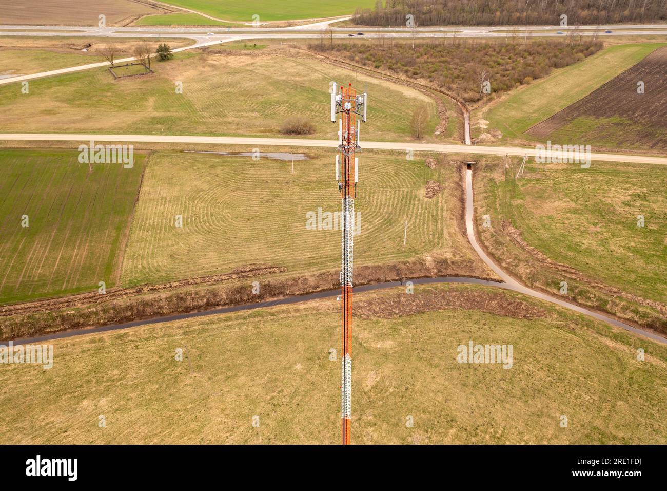 Drone photography of radio tower in the middle of fields during summer ...