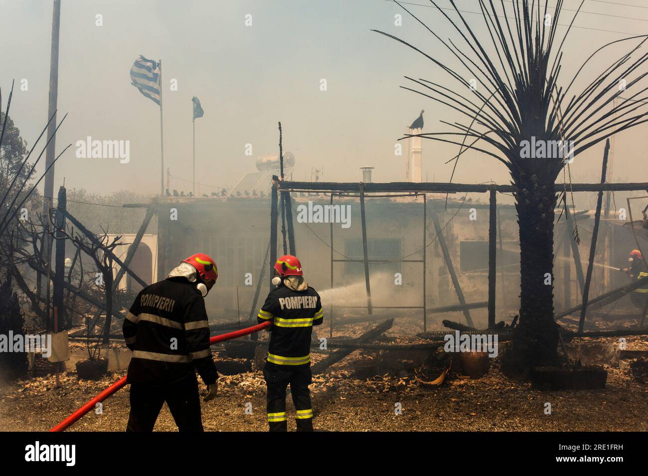 Gennadi, Greece. 24th July, 2023. Romanian firefighters try to ...