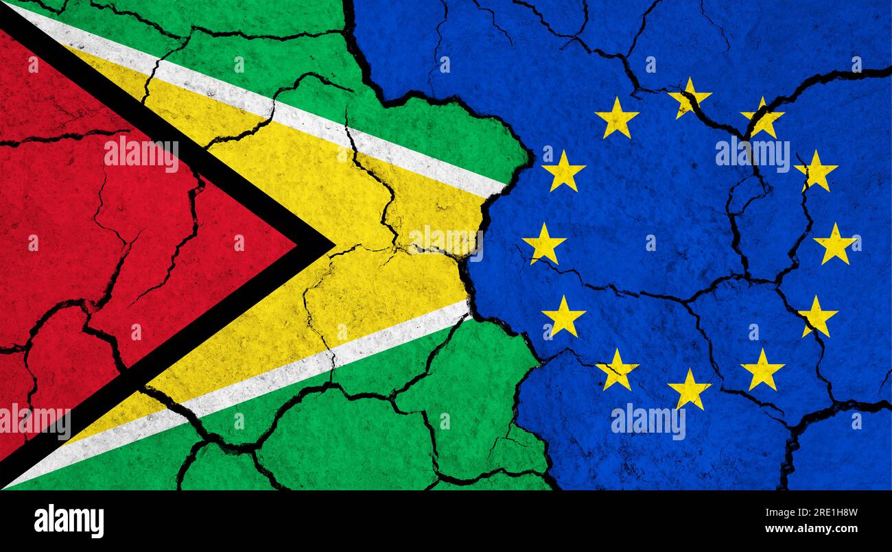Flags of Guyana and European Union on cracked surface - politics ...
