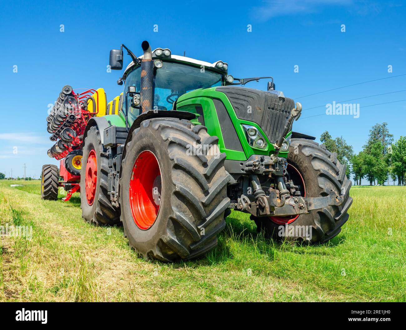 New big red modern farm tractor with quad tracks for powerful combine ...
