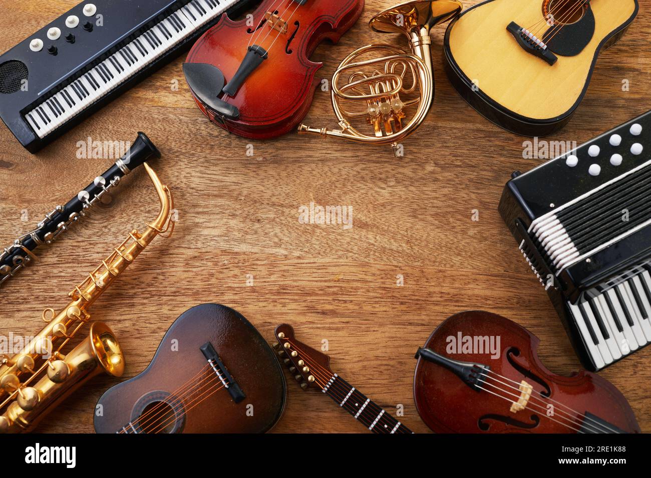 Frame of different musical instruments on wooden background Stock Photo ...