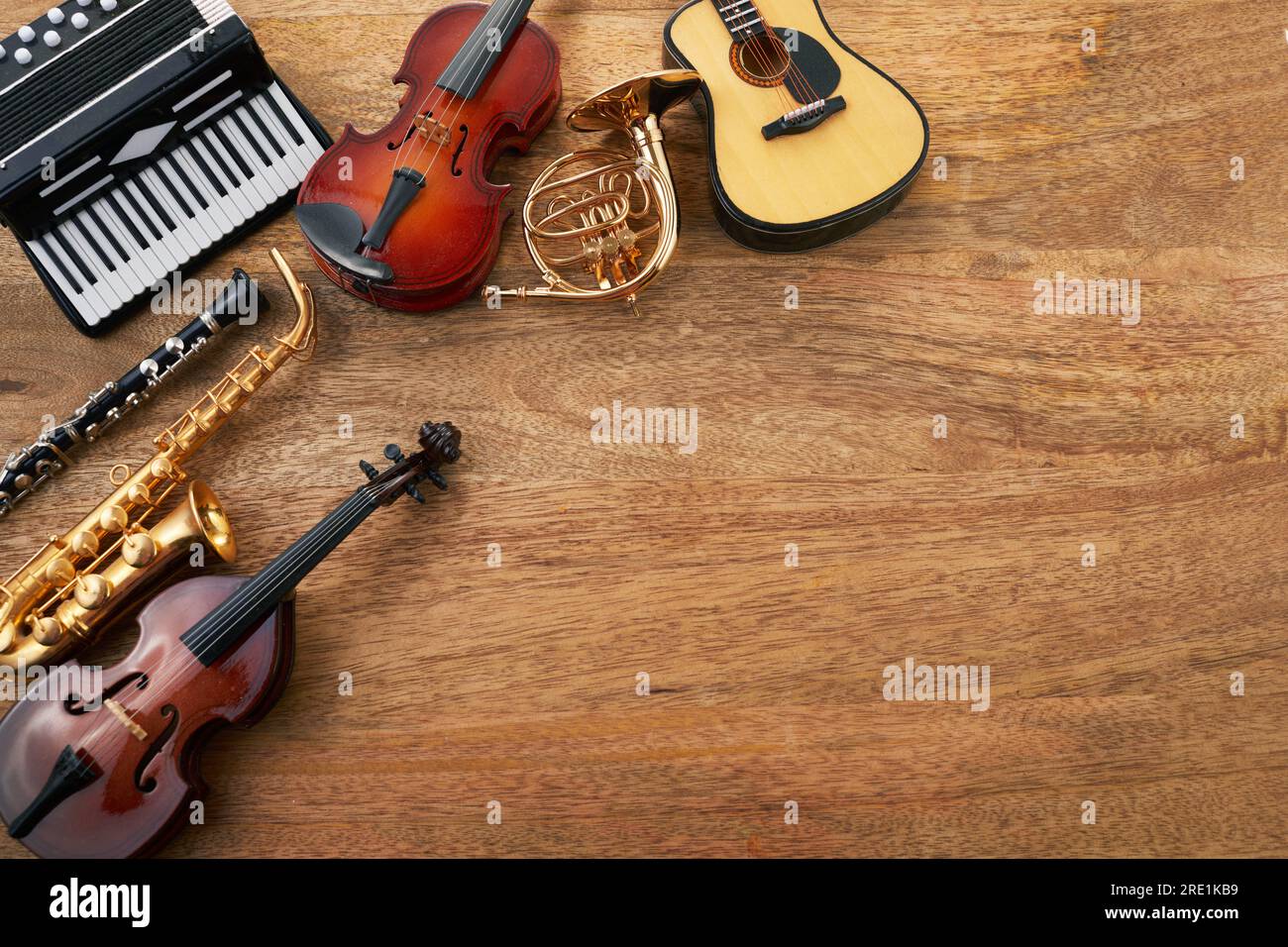 Frame of different musical instruments on wooden background Stock Photo ...