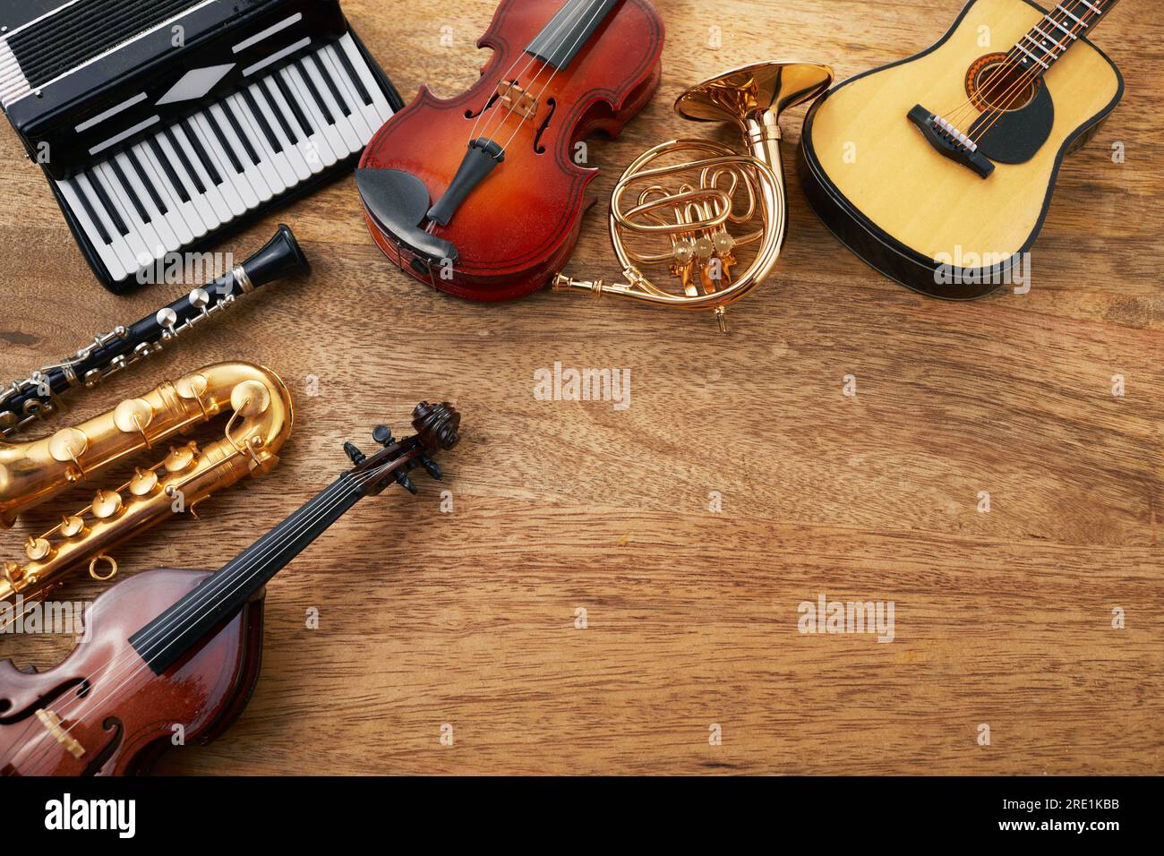 Frame of different musical instruments on wooden background Stock Photo ...