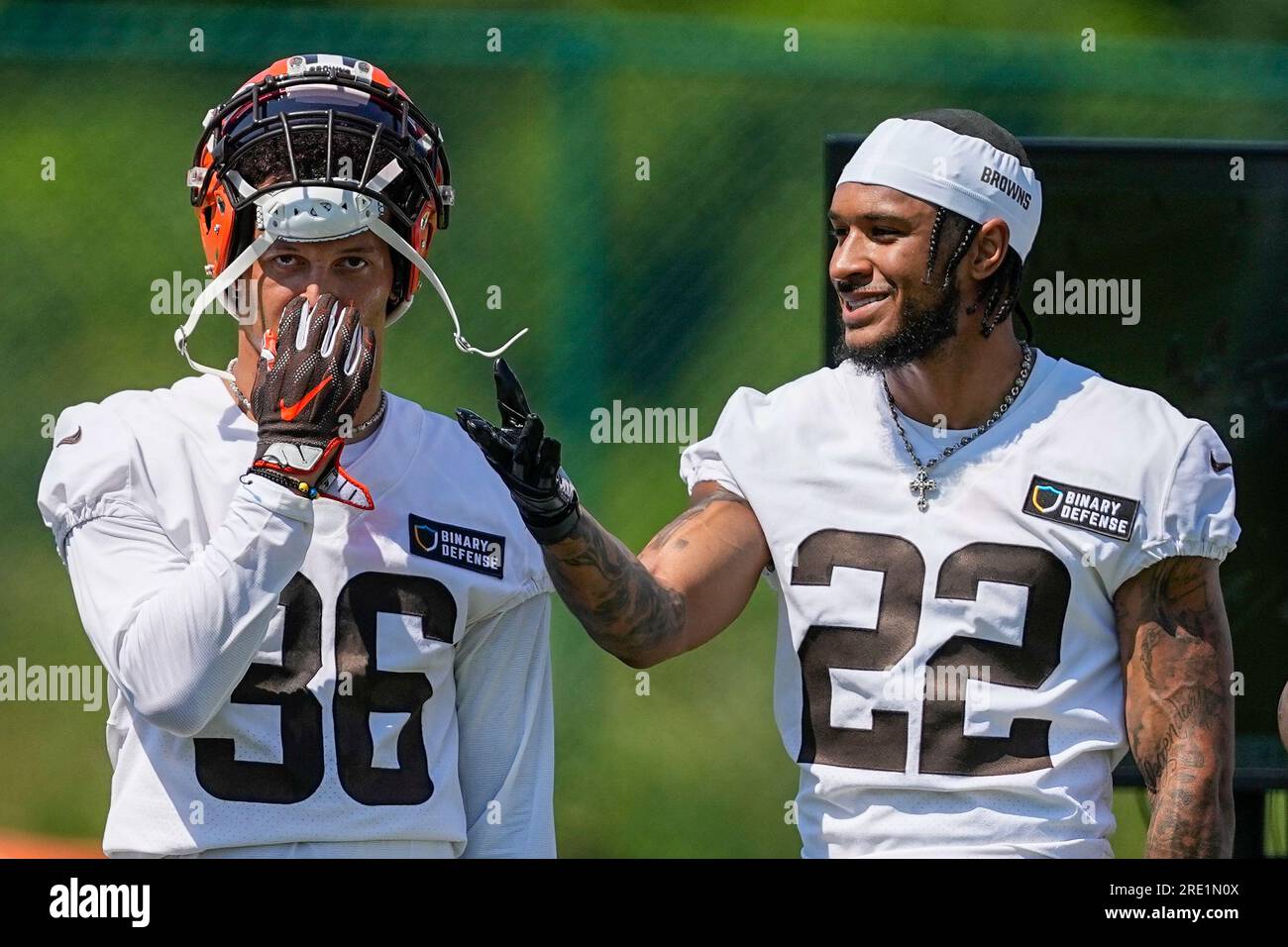 Cleveland Browns' Grant Delpit, right, talks with Bubba Bolden during ...
