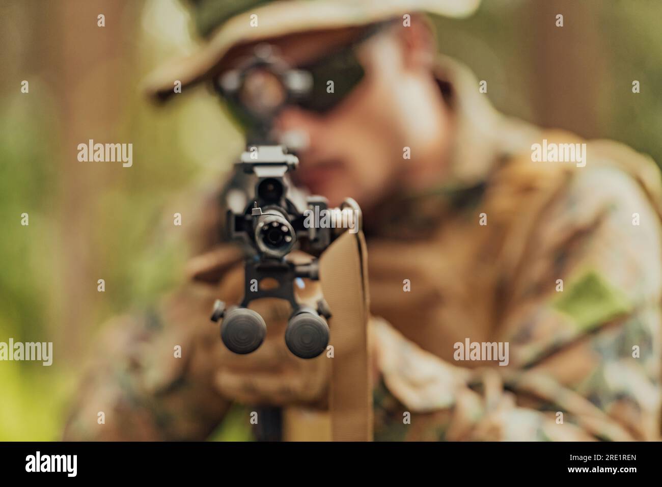 A modern warfare soldier on war duty in dense and dangerous forest ...