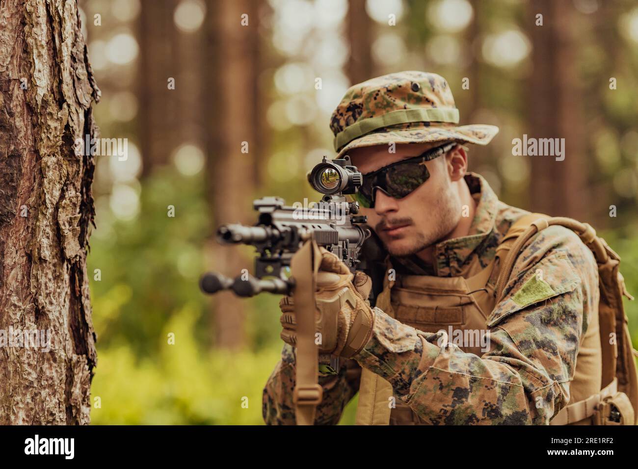 A modern warfare soldier on war duty in dense and dangerous forest ...