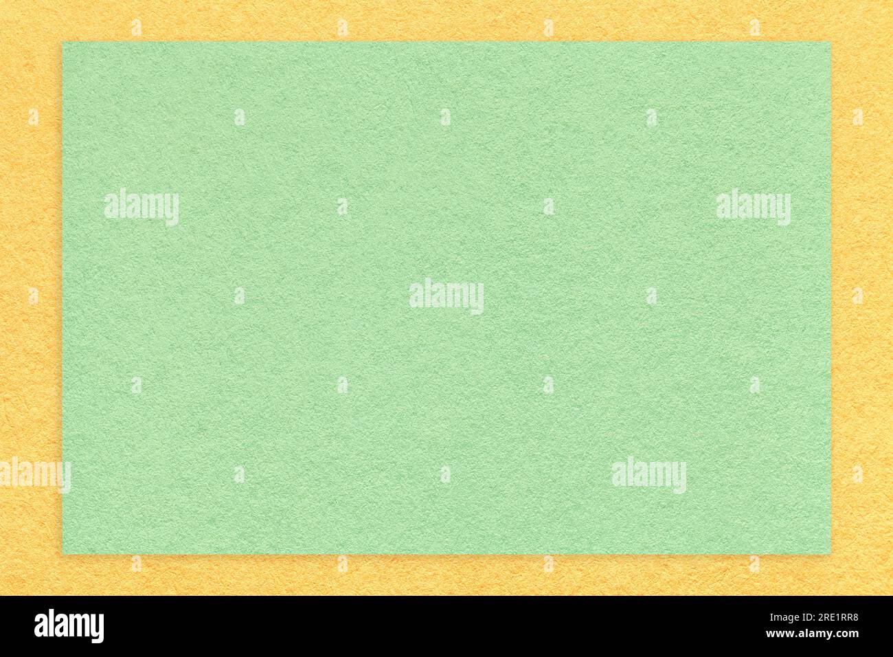 Texture of craft pastel light green color paper background with yellow ...
