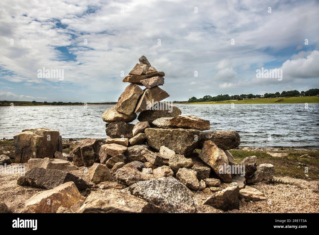 A pile of rocks on the foreshore of Colliford reservoir, Lake ,on ...
