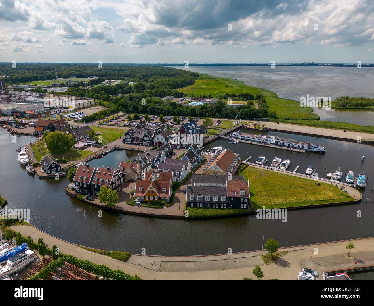 Aerial drone photo of the dutch town Huizen in Utrecht. It has a large ...