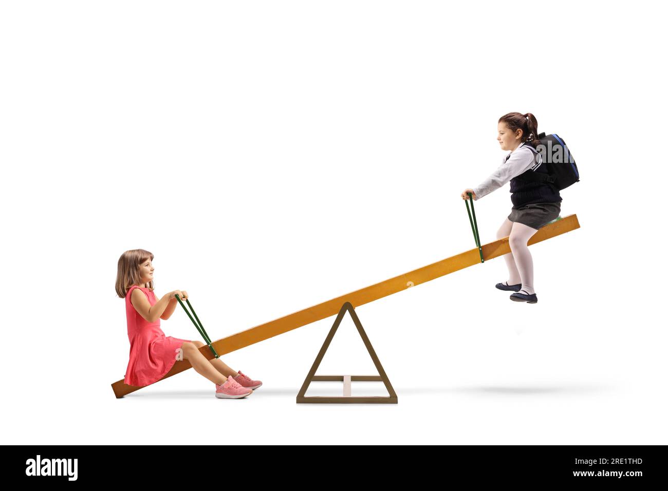 Two girls playing on a seesaw isolated on white background Stock Photo ...