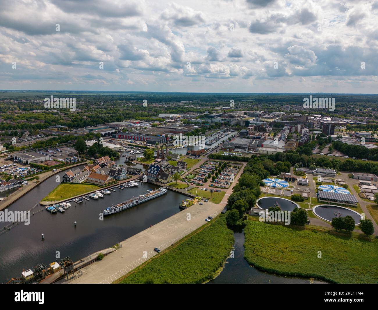 Aerial drone photo of the dutch town Huizen in Utrecht. It has a large ...