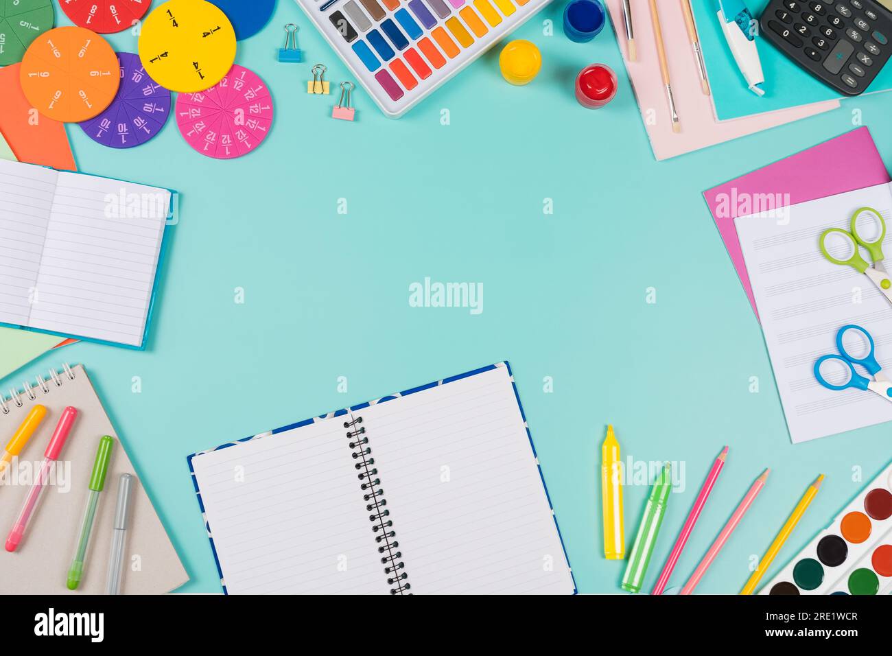 Back to school background. Colored pencils, books, notebooks, pens ...