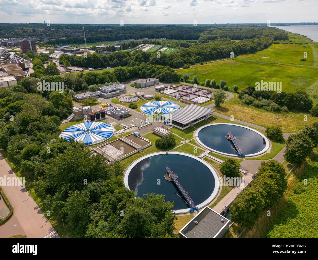 Aerial drone photo of a water treatment plant in the dutch town Huizen ...