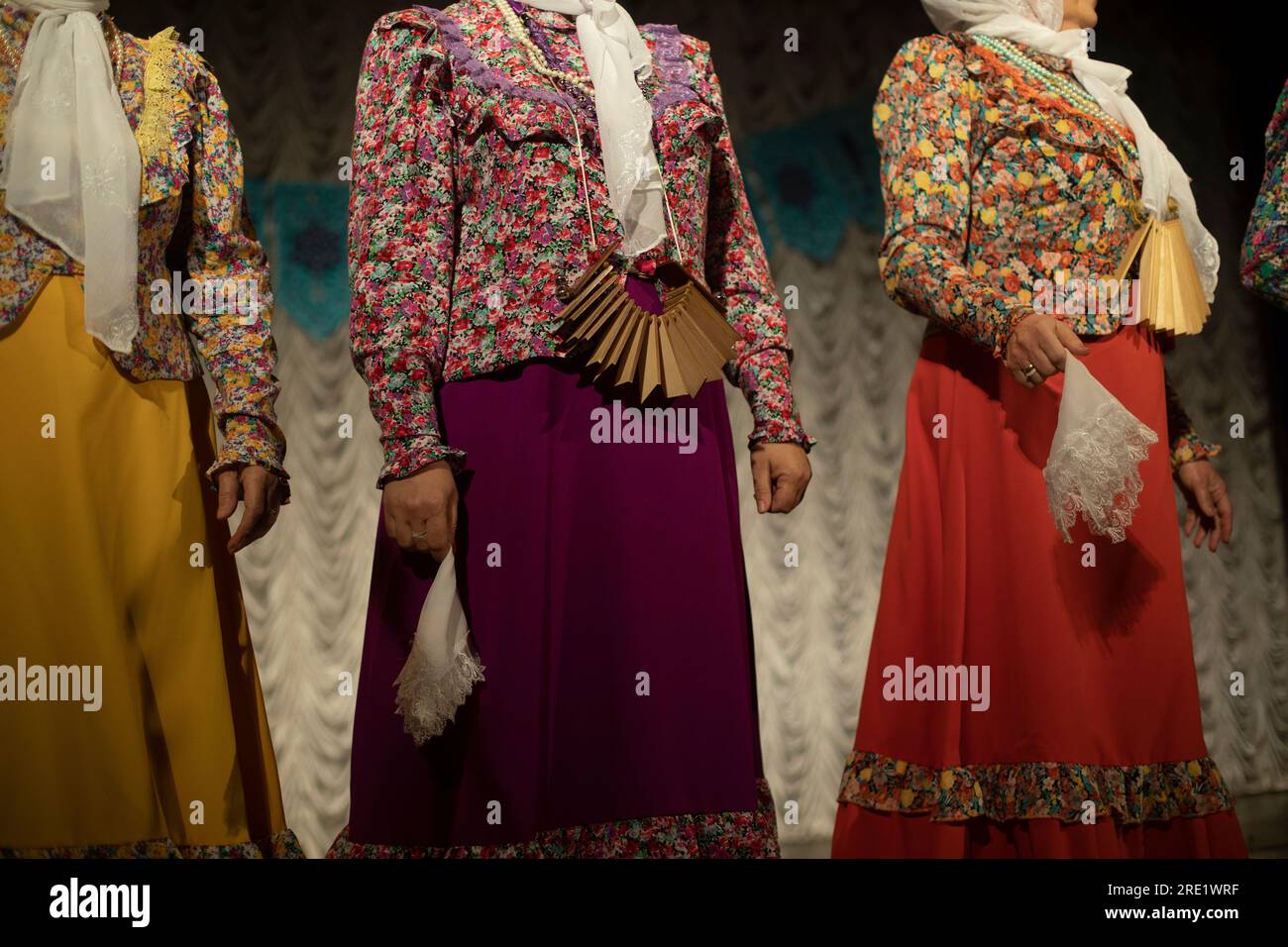 Women in folk costumes. Slavic folk costume. Folklore ensemble on stage ...