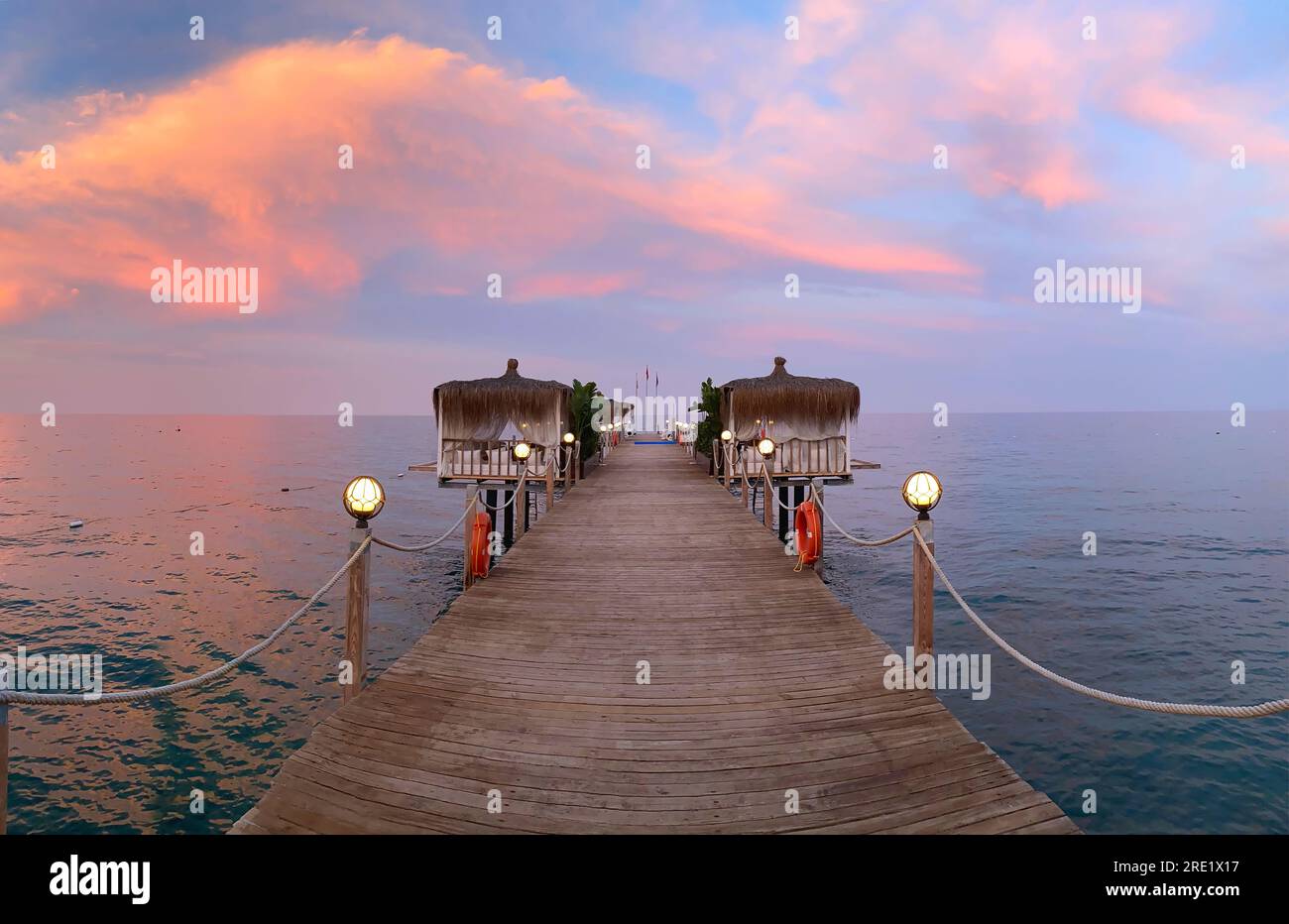 Pavilions at the sea pier with lovely sunset, afterglow Stock Photo - Alamy
