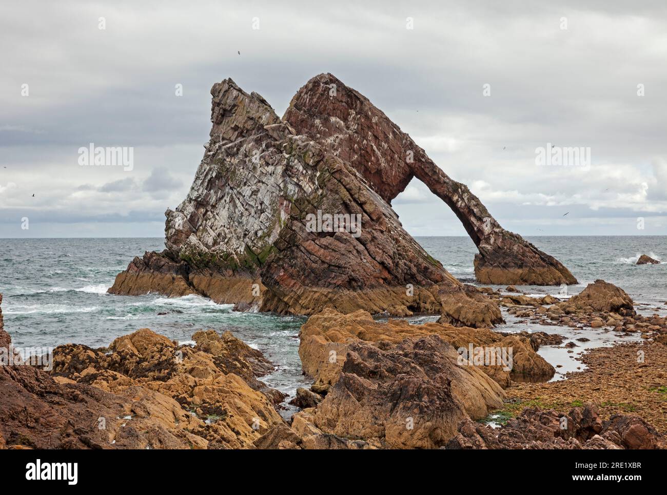 Bow Fiddle Rock, Portknockie, Moray, Scotland, UK. 24 July 2023. Clody ...